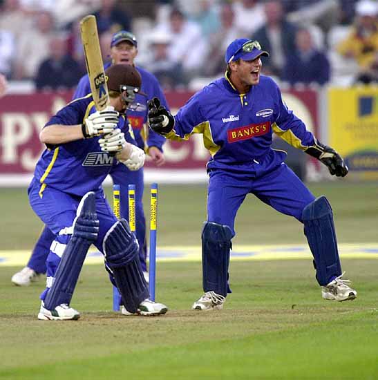 Derbyshire keeper Luke Sutton makes to stump Ali Brown off Dean but he ...