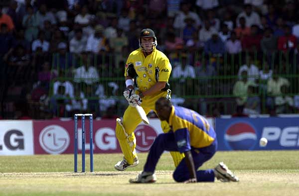 Hayden manages to drive a ball back past bowler Gunaratne in his ...