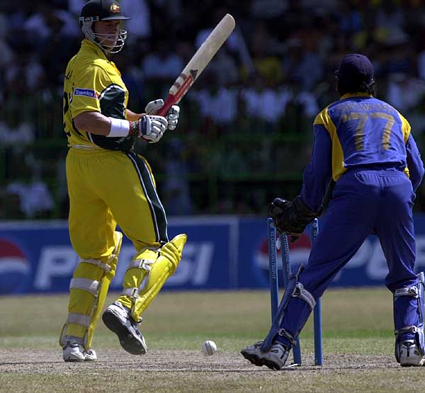 Hayden turns to see his wicket broken by a ball from De Silva ...