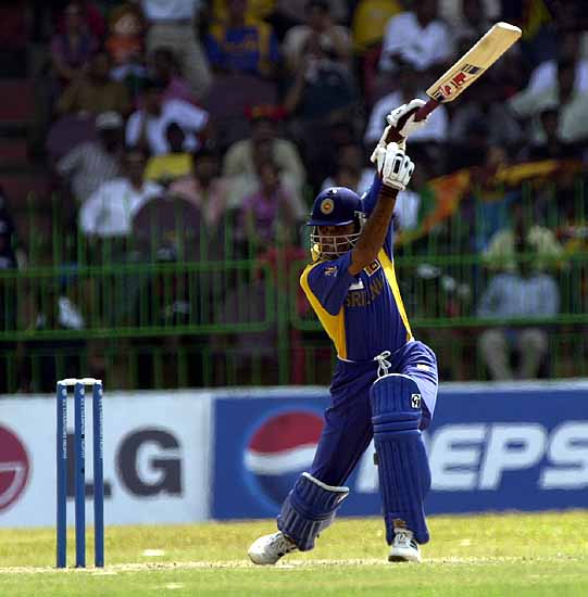 Atapattu with a spectacular looking drive in his innings of 10 ...