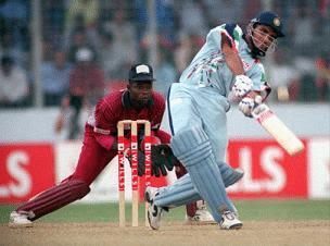 Ganguly lofts a cross batted shot during his innings of 83 ...