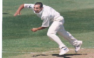 Gary Butcher bowling for Glamorgan during a Championship match in April ...