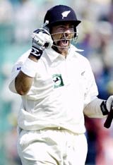 Craig McMillan celebrates his century | ESPNcricinfo.com