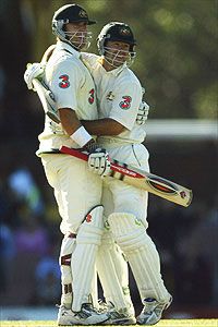 Matthew Hayden of Australia is congratulated by team mate Ricky Ponting ...
