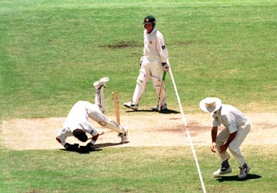 Adam Parore falls over the stumps | ESPNcricinfo.com
