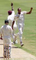 Walsh celebrates the dismissal of Bacher, caught by Philo Wallace ...