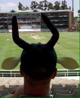 A South African spectator wearing a Springbok cap watches at the ...