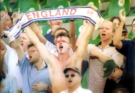 Crowd at the Gaddafi Stadium enjoy some rare moments during the match ...