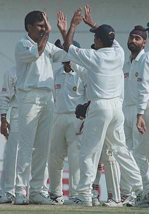 Srinath being congratulated by Sunil Joshi | ESPNcricinfo.com