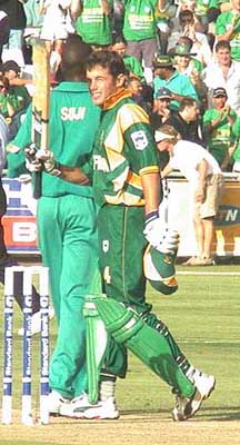 Neil McKenzie acknowledges the applause at he gets his 100 ...