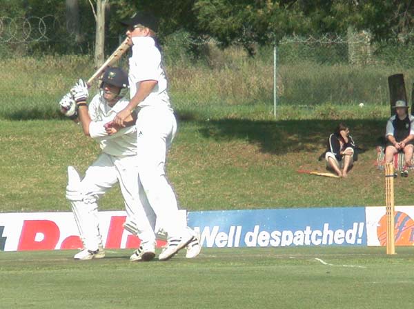 WP opening batsman Andrew Puttick drives a ball through the covers ...