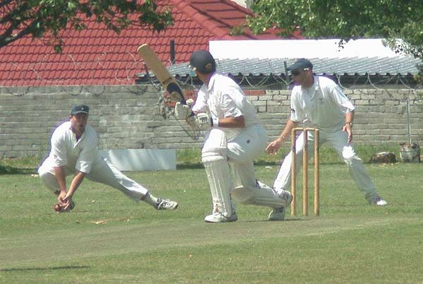 Steve Mendes of Almar has a narrow escape as he edges a ball to CTGP's ...