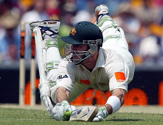 Damien Martyn dives to make his ground during a run at Brisbane ...