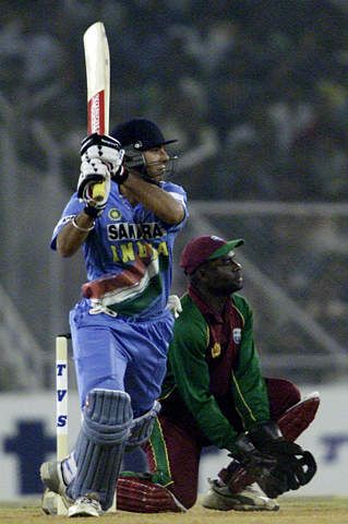 Yuvraj Singh cuts as Ridley Jacobs looks on at Ahmedabad | ESPNcricinfo.com