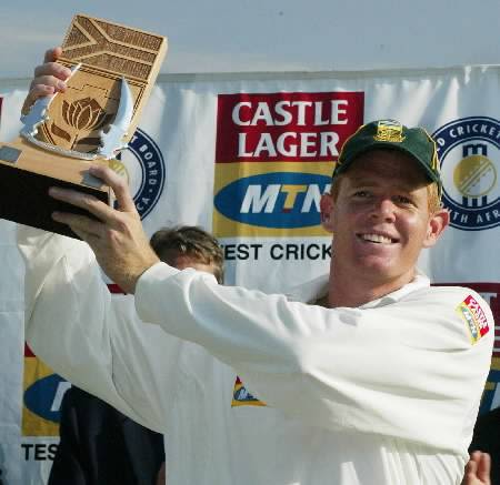Shaun Pollock holds the Castle Lager/MTN trophy after 2-0 win ...