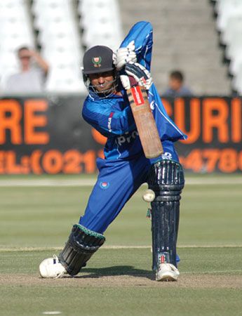 HD Ackerman plays forward to a delivery during his innings ...