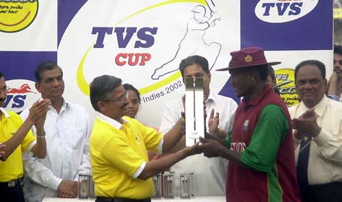 West Indies captain Carl Hooper receives the TVS cup following his side ...