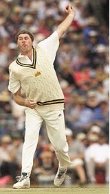 Bruce Reid of the Chairman's XI sends down a delivery | ESPNcricinfo.com