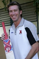 Glenn McGrath poses with his bat | ESPNcricinfo.com
