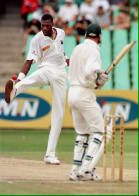Curtley Ambrose kicks the ball in frustration | ESPNcricinfo.com