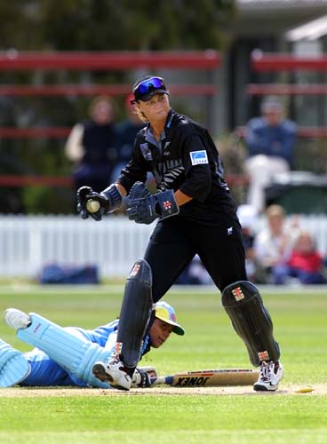 Indian batter Deepa Kulkarni slides along the ground but fails to cross ...