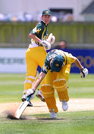 Australian cathryn Fitzpatrick slides the bat across the line to manage ...