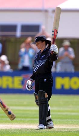 White Fern captain Emily Drumm raises her bat to her team on the ...