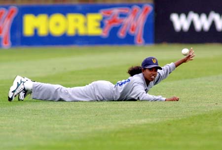 Sri Lankan fielder Hiruka Dilani Fernando dives for the ball ...