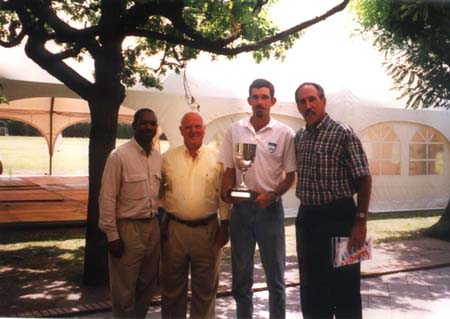 The Trophy with hosts, l to r, Robert Weekes, Armando Fioriolli ...
