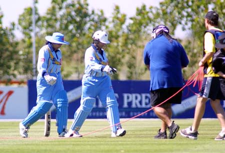 Sky TV crew lead out the Indian openers, Smitha Harikrishna and Purnima ...