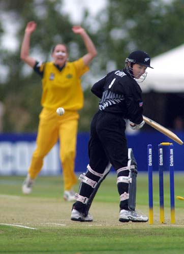 Anna O'Leary looks at the bails after being bowled by Therese McGregor ...