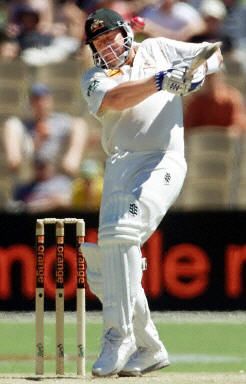 Shane Warne fends off a Pollock delivery | ESPNcricinfo.com