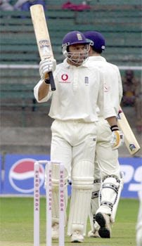Mark Ramprakash raises his bat to the crowd after reaching his fifty ...