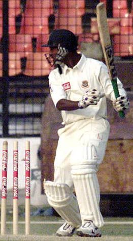 Bangladeshi batsman Tapash Baishya is bowled by Jermaine Lawson ...